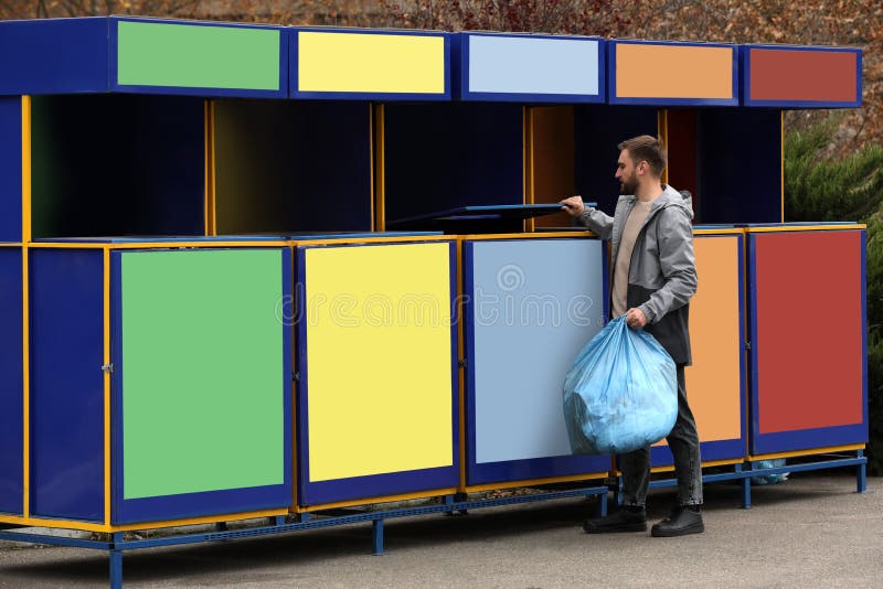 Man Throwing Garbage into Bin at Recycling Point Outdoors Stock Photo ...
