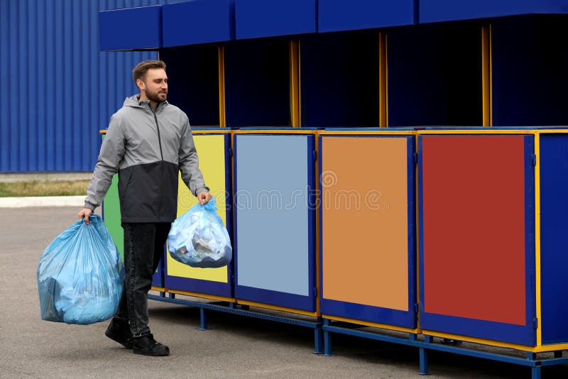 Man Throwing Garbage at Recycling Point Outdoors Stock Image - Image of ...