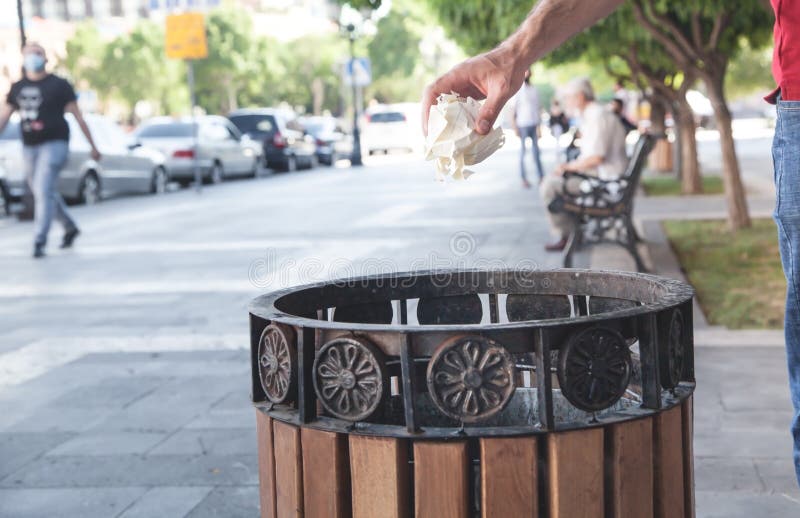 Man Throwing Garbage in a Trash Bin Stock Photo - Image of clean ...