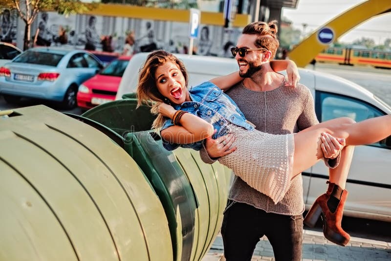 Man Throwing Girl in the Garbage Stock Image - Image of holding, scream ...