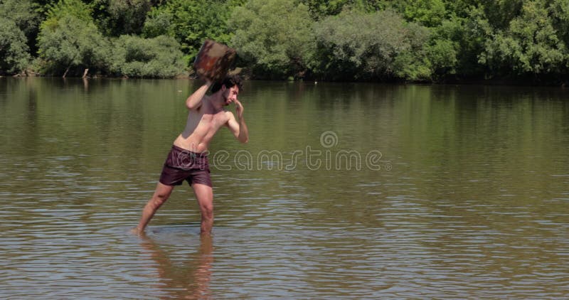 Man Throwing a Log in a River Stock Footage - Video of hobby, splash ...
