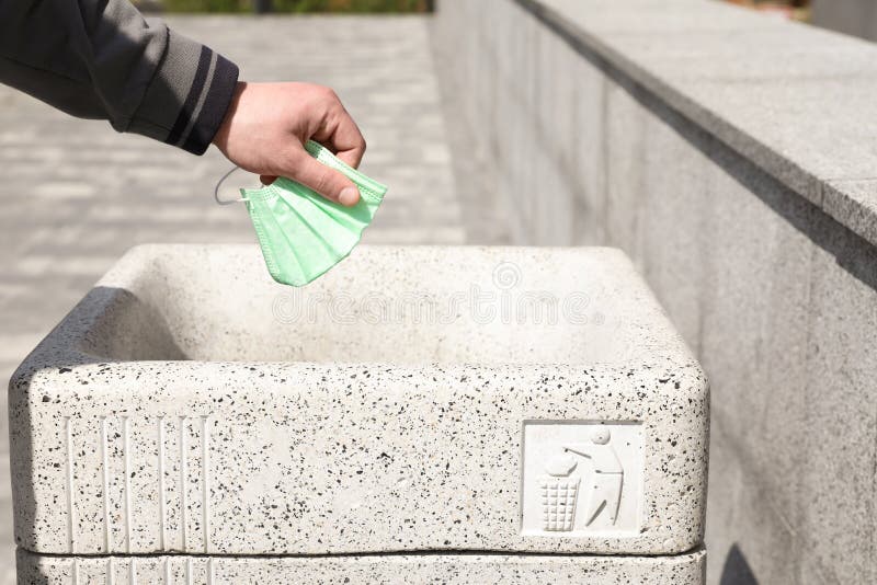 Man Throwing Medical Mask into Trash Bin Outdoors, Closeup Stock Photo ...
