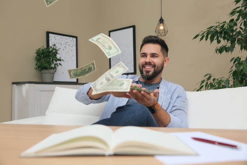 Young Man Throwing Money at Table Indoors Stock Image - Image of person ...