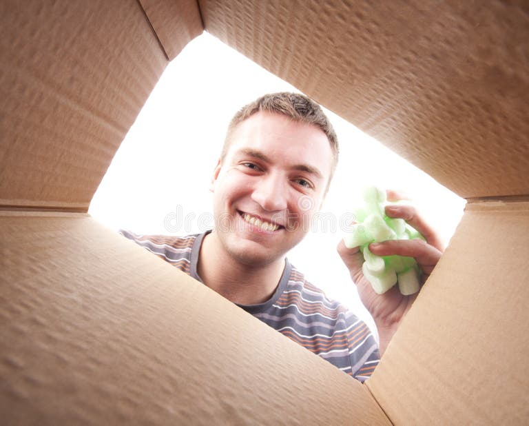 Man Throwing Packing Polyfoam into Cardboard Box Stock Photo - Image of ...