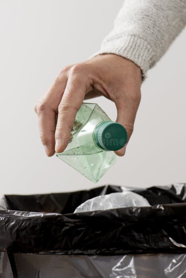 Man Throwing a Plastic Bottle To the Trash Bin Stock Image - Image of ...