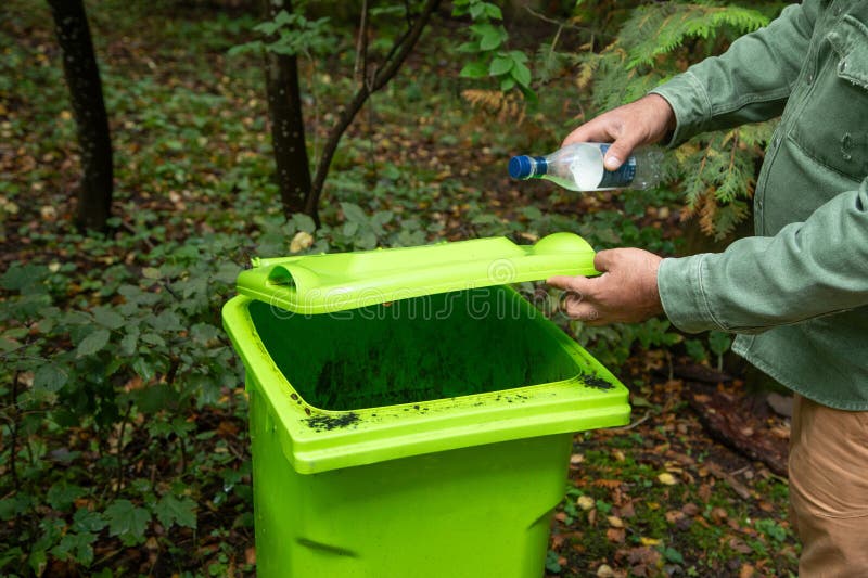 Man Throwing Plastic Bottle into Trash Bin Stock Photo - Image of ...