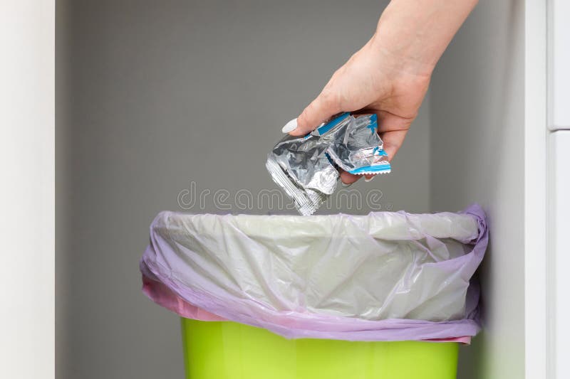 Man Throwing Plastic Packaging into Trash Bin at Home Stock Image ...