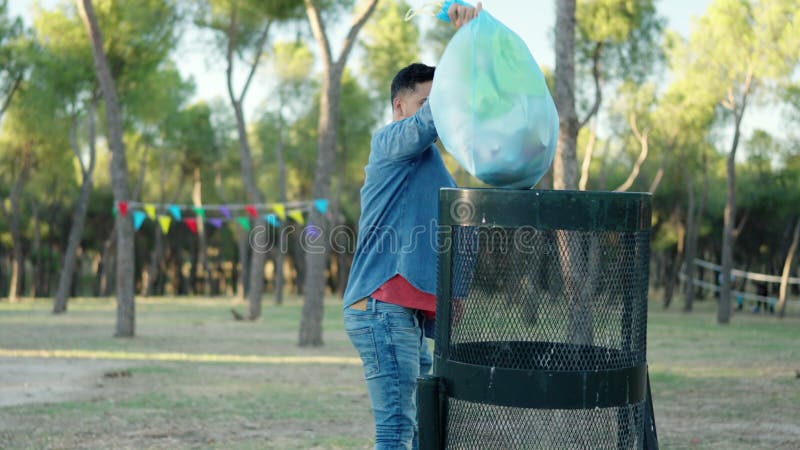 Man Throwing Rubbish Bag in a Park Stock Footage - Video of dump, save ...