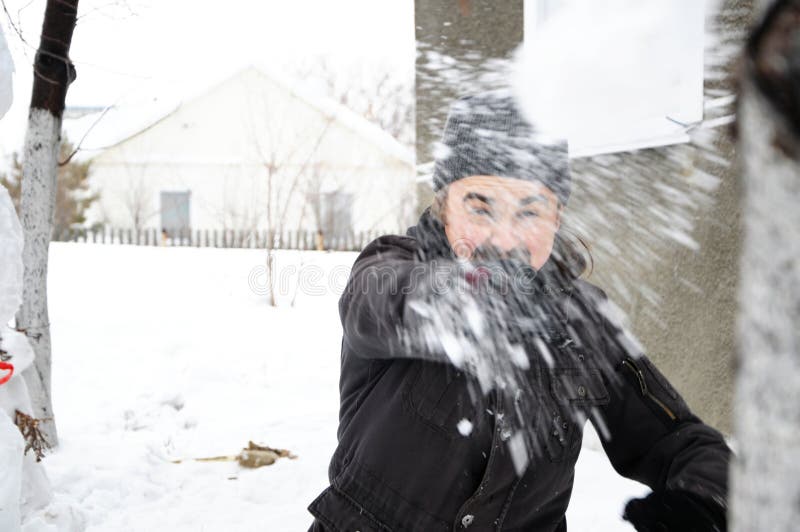 Man throwing a snowball stock image. Image of cold, recreation - 49157303