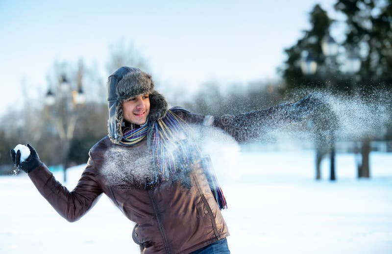 Man with a snowball stock photo. Image of landscape, outdoors - 60764404