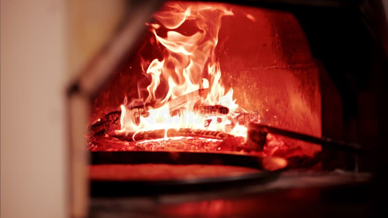 Man Throwing Wood in a Burning Fire Stock Footage - Video of sparks ...
