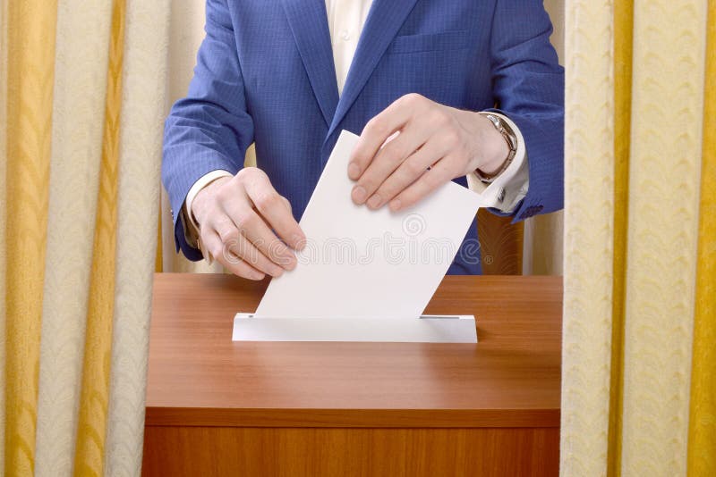 Man Throws A Ballot Into The Ballot Box Stock Image - Image of ...