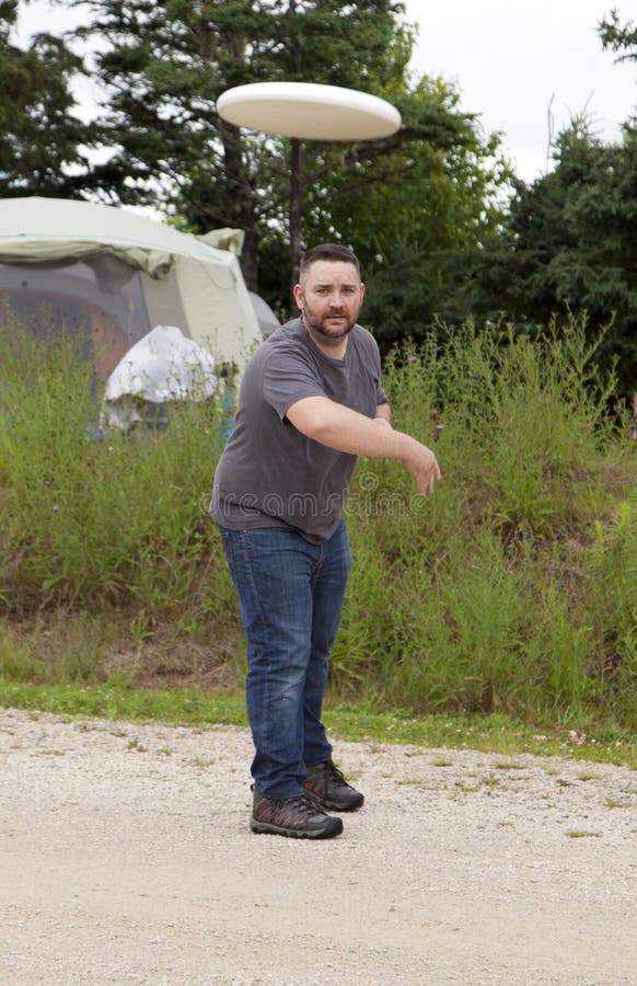 Man throws a frisbee stock image. Image of playful, relaxation - 98220253