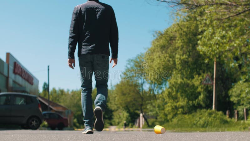 A Man Throws Out a Used Plastic Cup on Nature Stock Footage - Video of ...