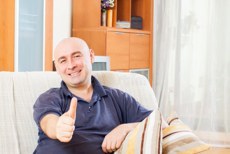 Man with thumbs up stock photo. Image of room, living - 45365382