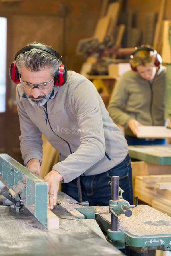 Man at timber workshop stock image. Image of carpenter - 170654139