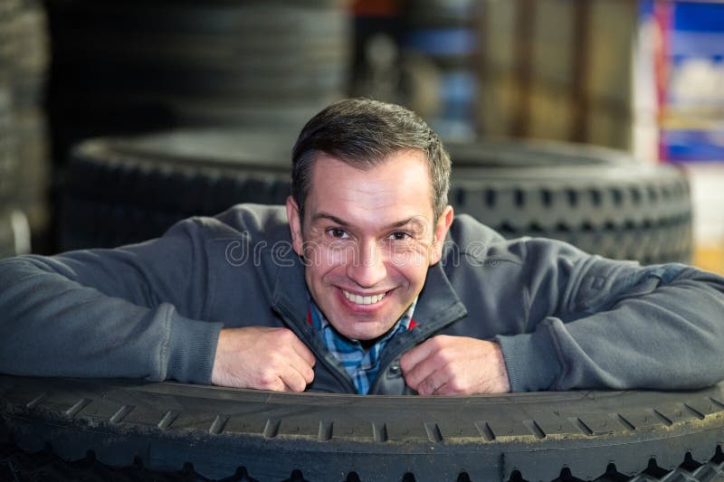 Man in the tire stock photo. Image of grass, environmental - 272192008