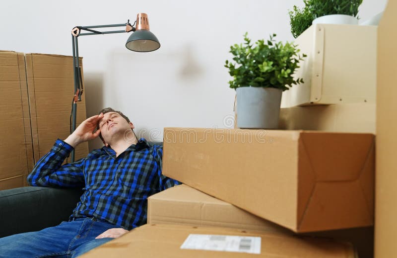 Man tired of moving house stock image. Image of home - 26599137