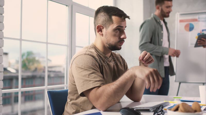 Man Tired Working on Pc in Creative Office. Team Discussing ...