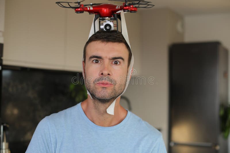 Man about To Fly with Drone Attached To His Head Stock Image - Image of ...