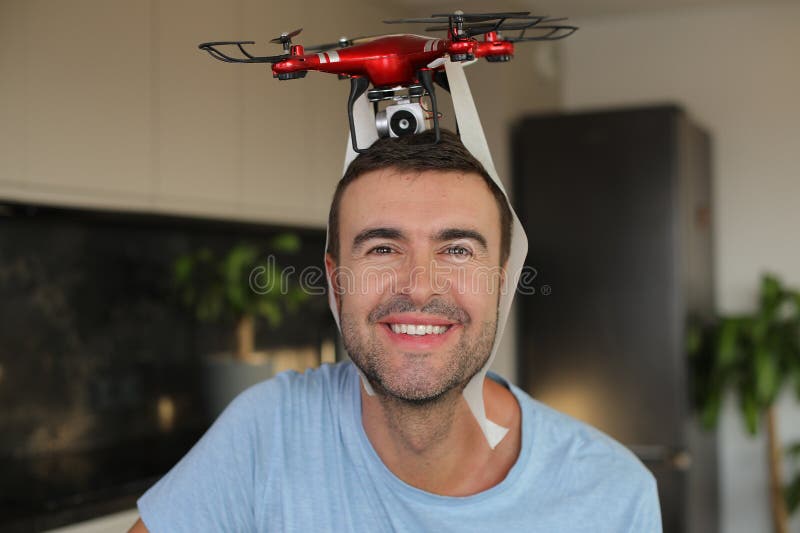 Man about To Fly with Drone Attached To His Head Stock Photo - Image of ...