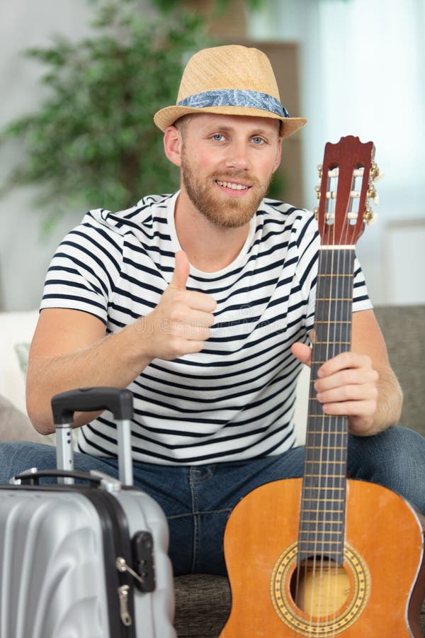 Man about To Go on Holiday with Suitcase and Guitar Stock Photo - Image ...