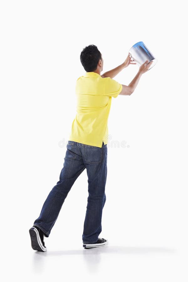 Man about To Splatter Paint on Wall. Conceptual Image Stock Image ...