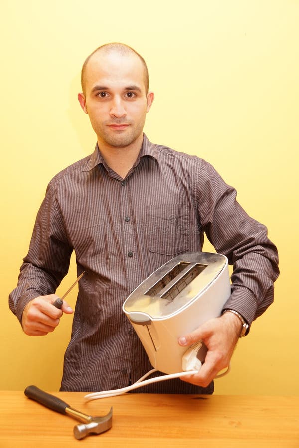 Man with toaster stock photo. Image of repairing, wooden - 24734658