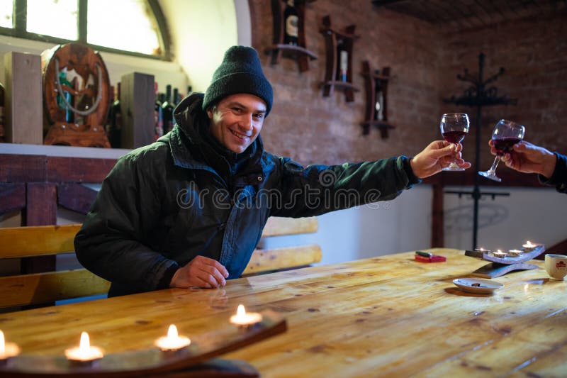 Man Toasting with Red Wine in Cellar Stock Photo - Image of glass ...