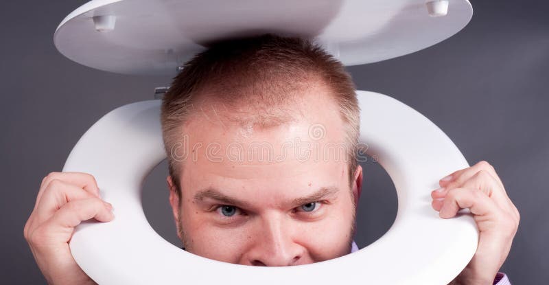 Man sitting on toilet stock photo. Image of bathroom - 16385658
