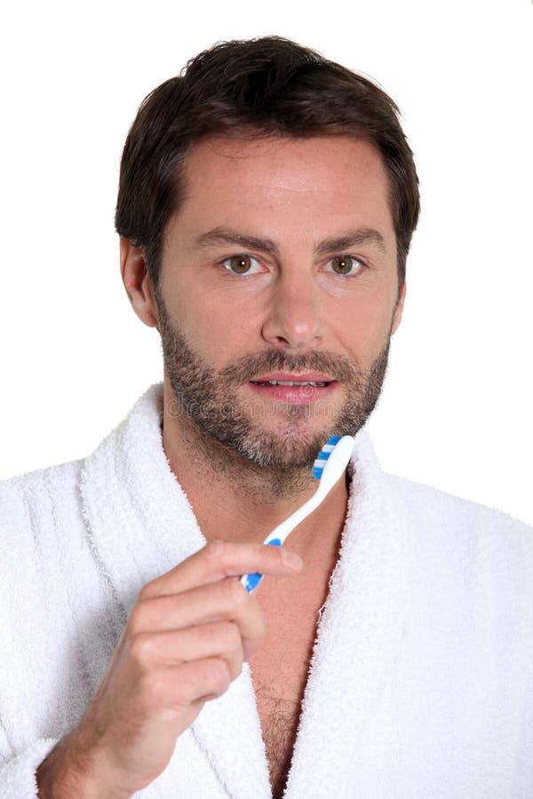 Man with toothbrush stock image. Image of peignoir, husband - 22536857