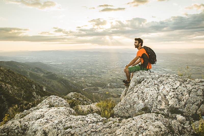 Man on Top of a Mountain Looking at the View Stock Photo - Image of ...
