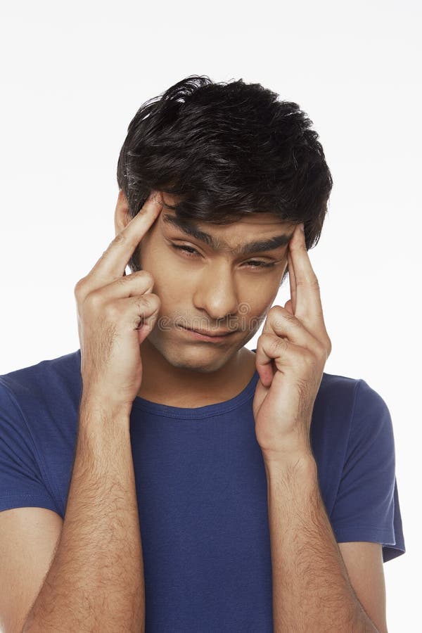 Man touching his forehead stock image. Image of individuality - 185326487