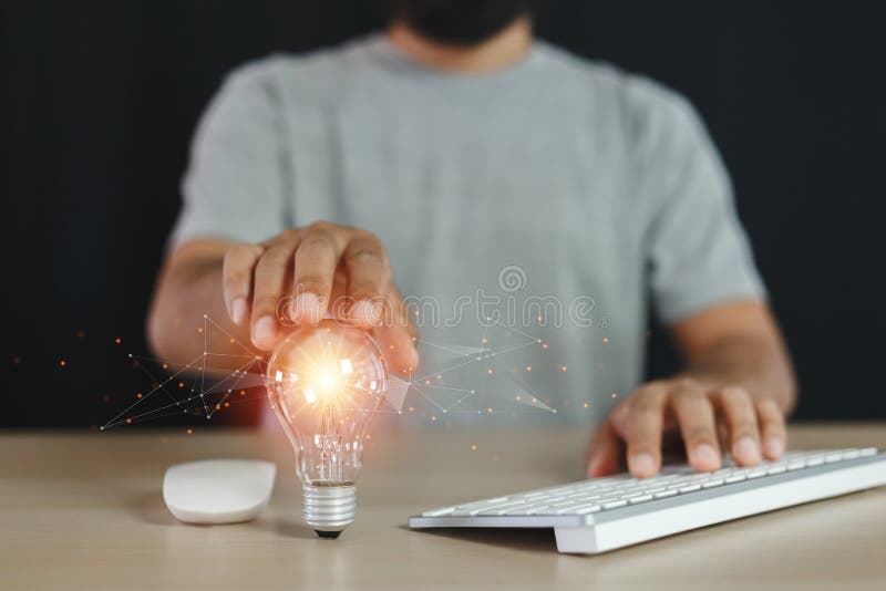 Man Touching Light Bulbs Using Computer Keyboard. Creative Innovation ...