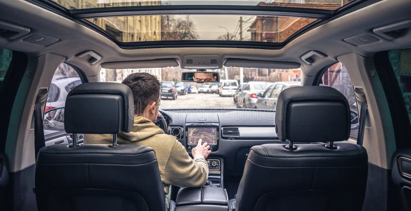 Man Touching Screen of a GPS Navigation System in His Car. Stock Image ...