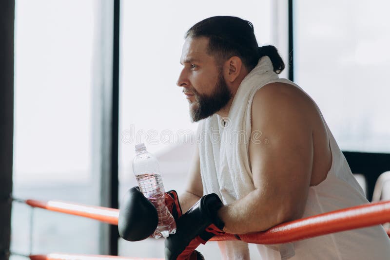 Man after Tough Training. Boxer Taking a Break Drinking from the Water ...