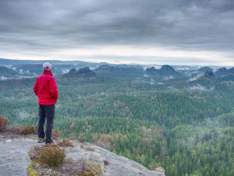 Hiker in Red Jacket Climbed Up To Peak Enjoy View. Mountain Climber ... Hiker in Red Jacket Climbed Up To Peak Enjoy View. Mountain Climber ...