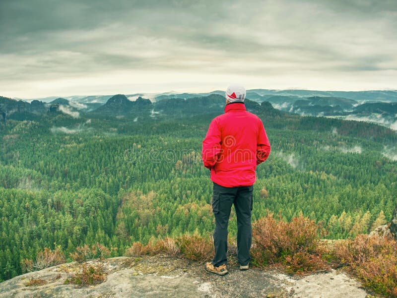 Hiker in Red Jacket Climbed Up To Peak Enjoy View. Mountain Climber ... Hiker in Red Jacket Climbed Up To Peak Enjoy View. Mountain Climber ...