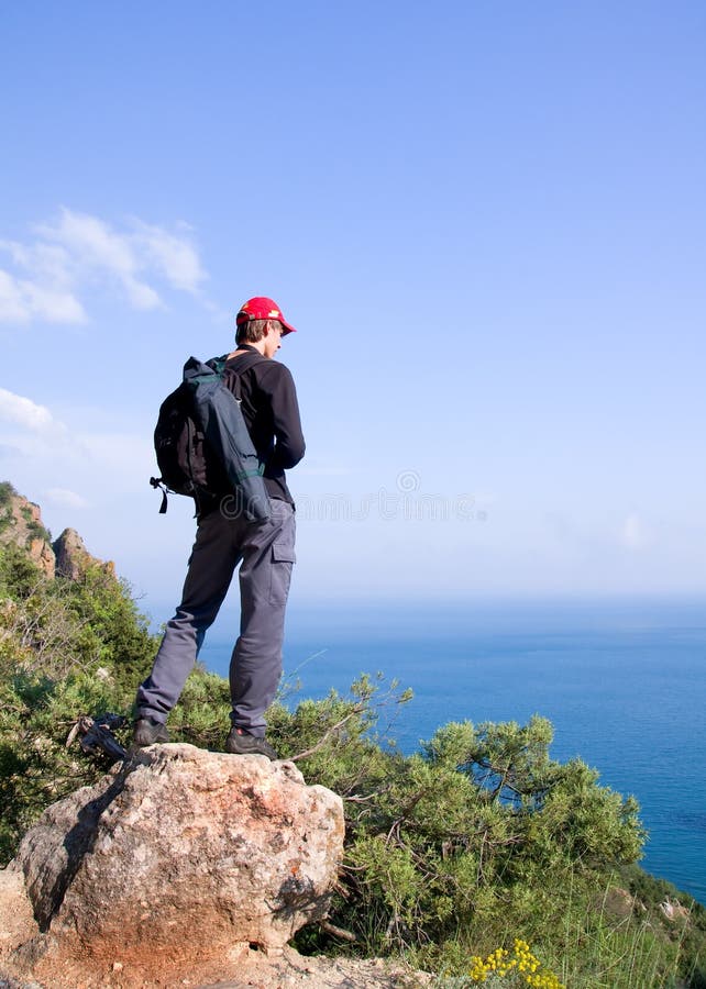 Man tourist in mountains. stock image. Image of path - 20593625