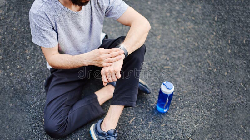 Man Tracking His Workout Progress with Smart Watch Stock Photo - Image ...