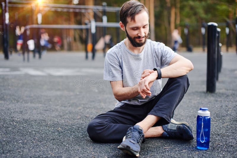 Man Tracking His Workout Progress with Smart Watch Stock Photo - Image ...