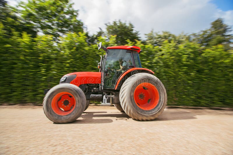 Man with Tractor in a Garden, Blurred Motion Stock Photo - Image of ...