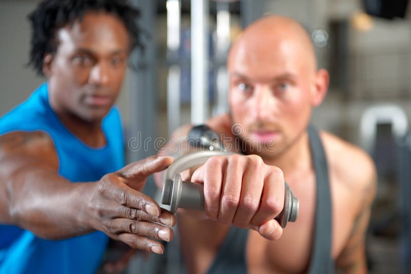 Man with trainer in gym stock photo. Image of fitness - 34407024