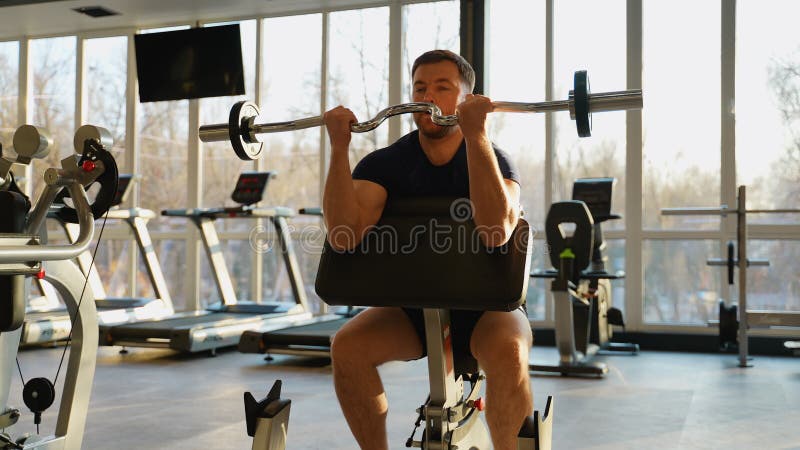 Man Training Biceps with Barbell in Gym Stock Video - Video of strength ...