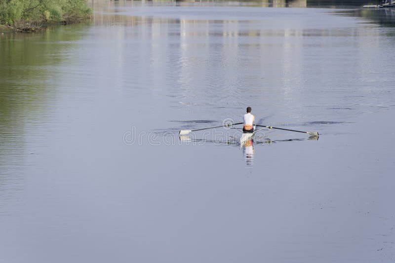 Man Training on Canoe To Practise Rowing during Early Morning on River ...