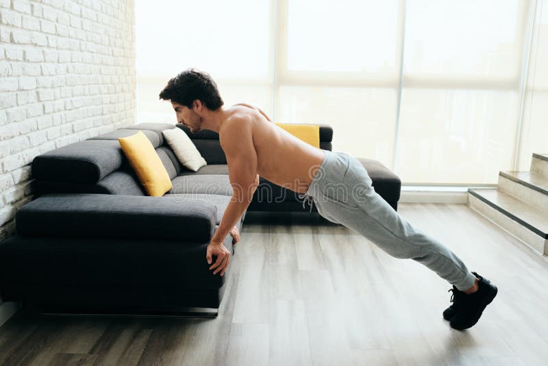 Man Doing Push-ups on Black Background Stock Photo - Image of brunette ...