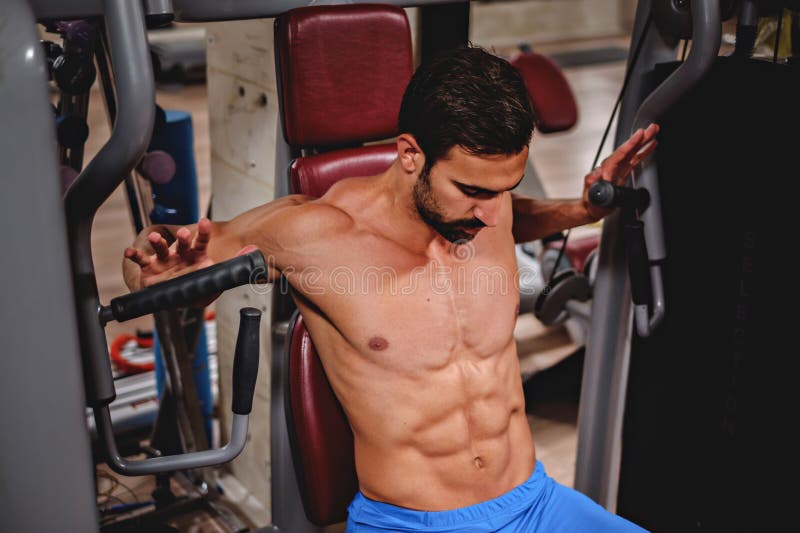 Man Training on the Chest Machine Stock Image - Image of bench ...