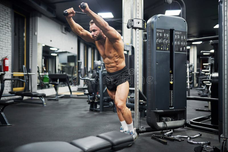 Man Training in Crossover Machine Indoors. Stock Photo - Image of ...