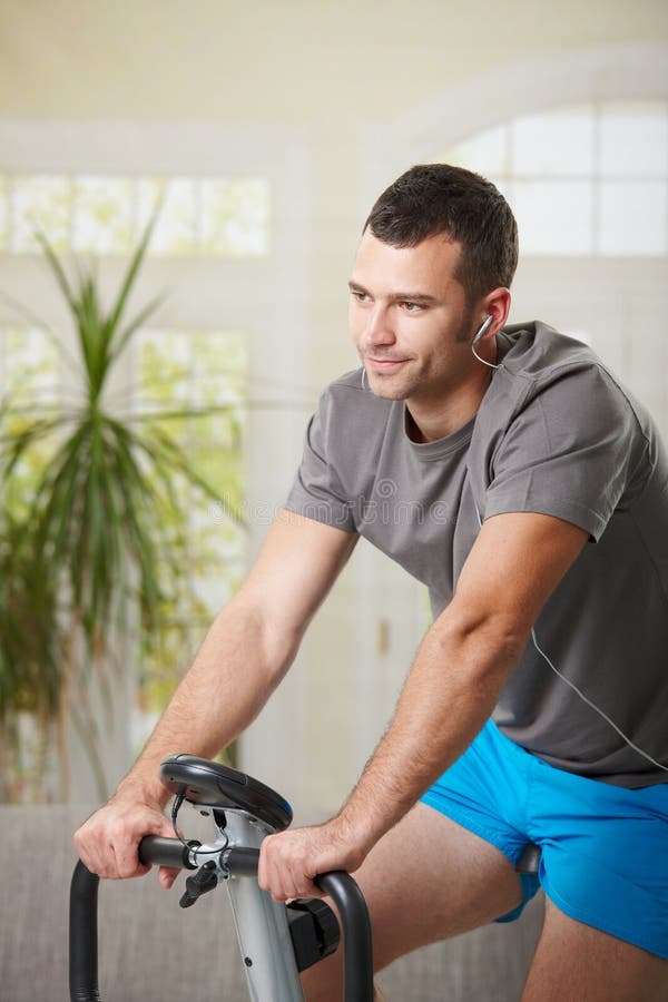 Man Training on Exercise Bike Stock Image - Image of alone, adult: 20941145