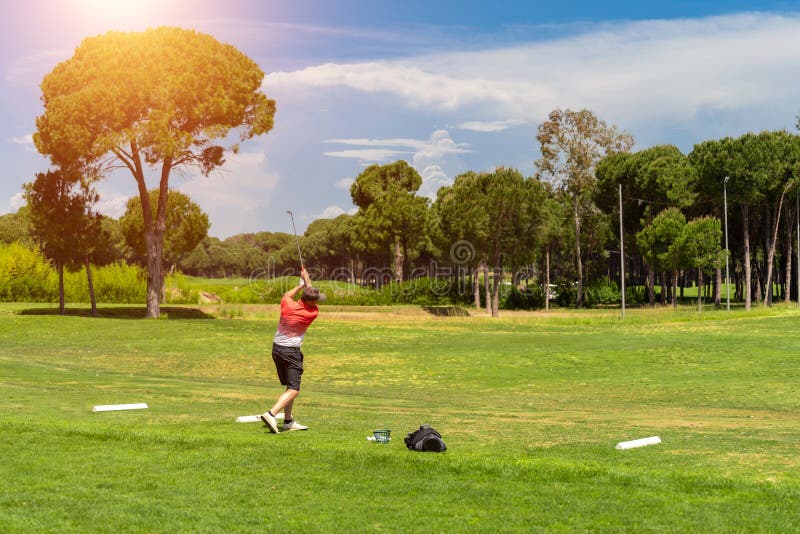 Man Training Golf Skills on a Driving Range on Golf Course Editorial ...